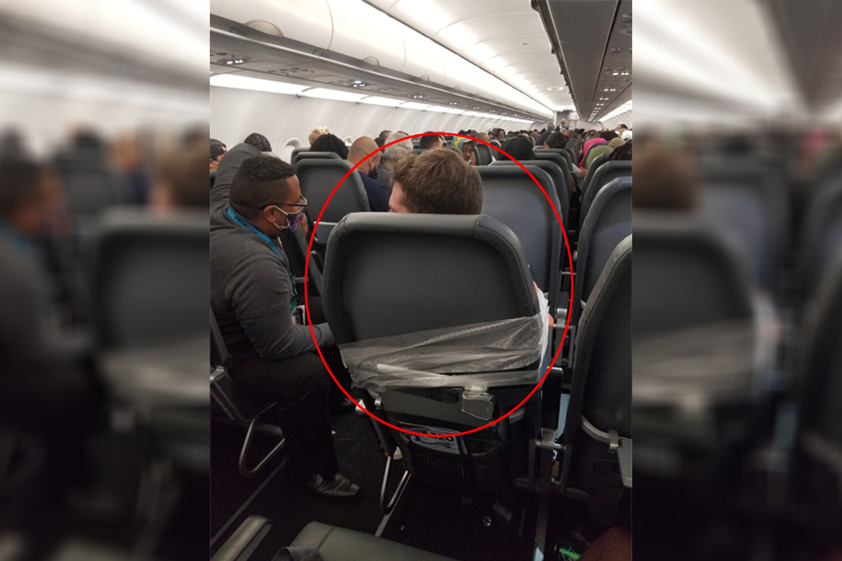 Flight attendants are removed after the deviant passenger is attached ...